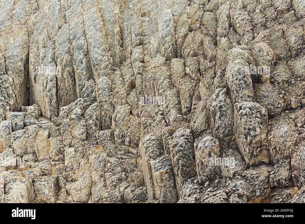 natural stone background, the remains of lava basalt columns form a ...