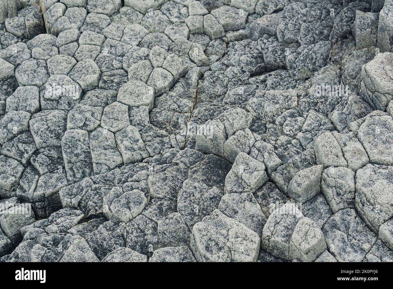 natural stone background, the bases of lava basalt columns form a kind ...