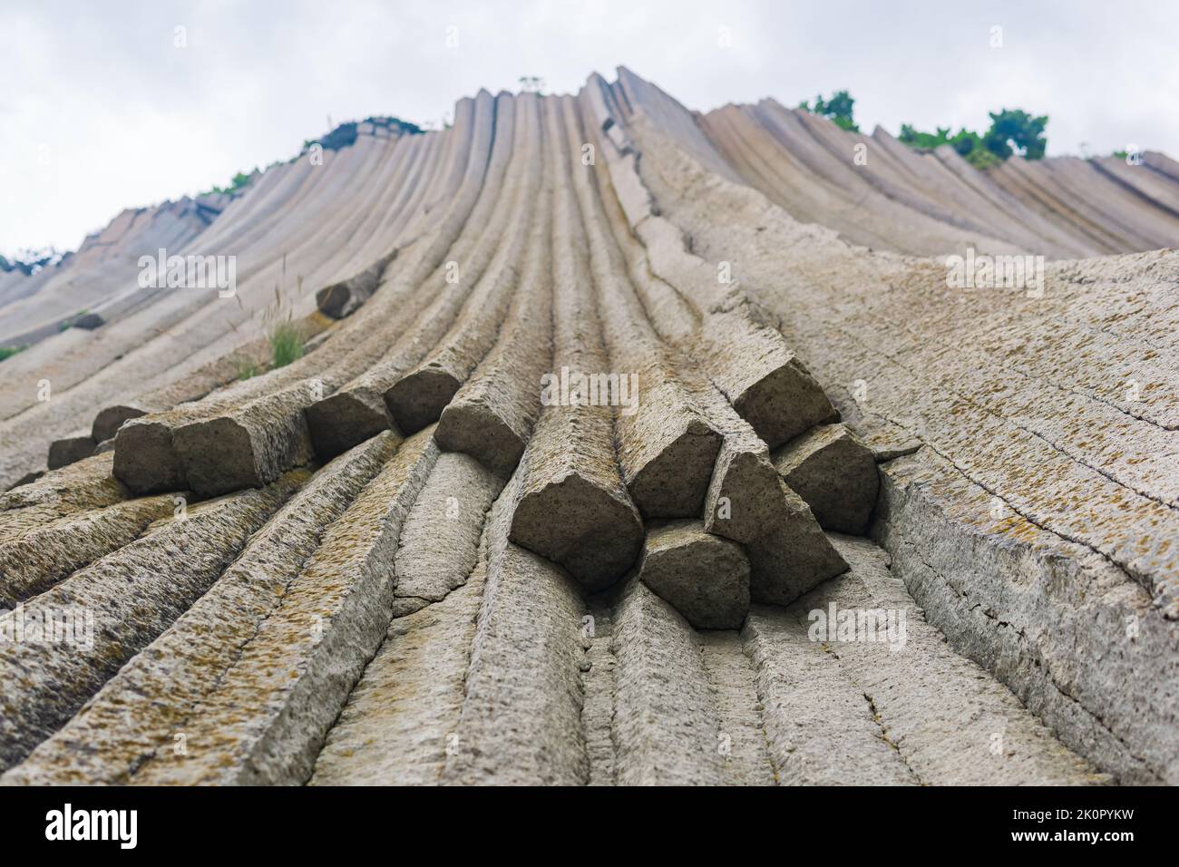 basalt columns forming a coastal rock at Cape Stolbchaty on Kunashir ...