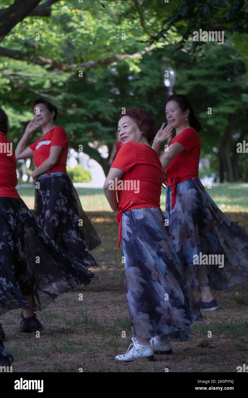 Part of a large group of Chinese American women at a yuanji dance ...