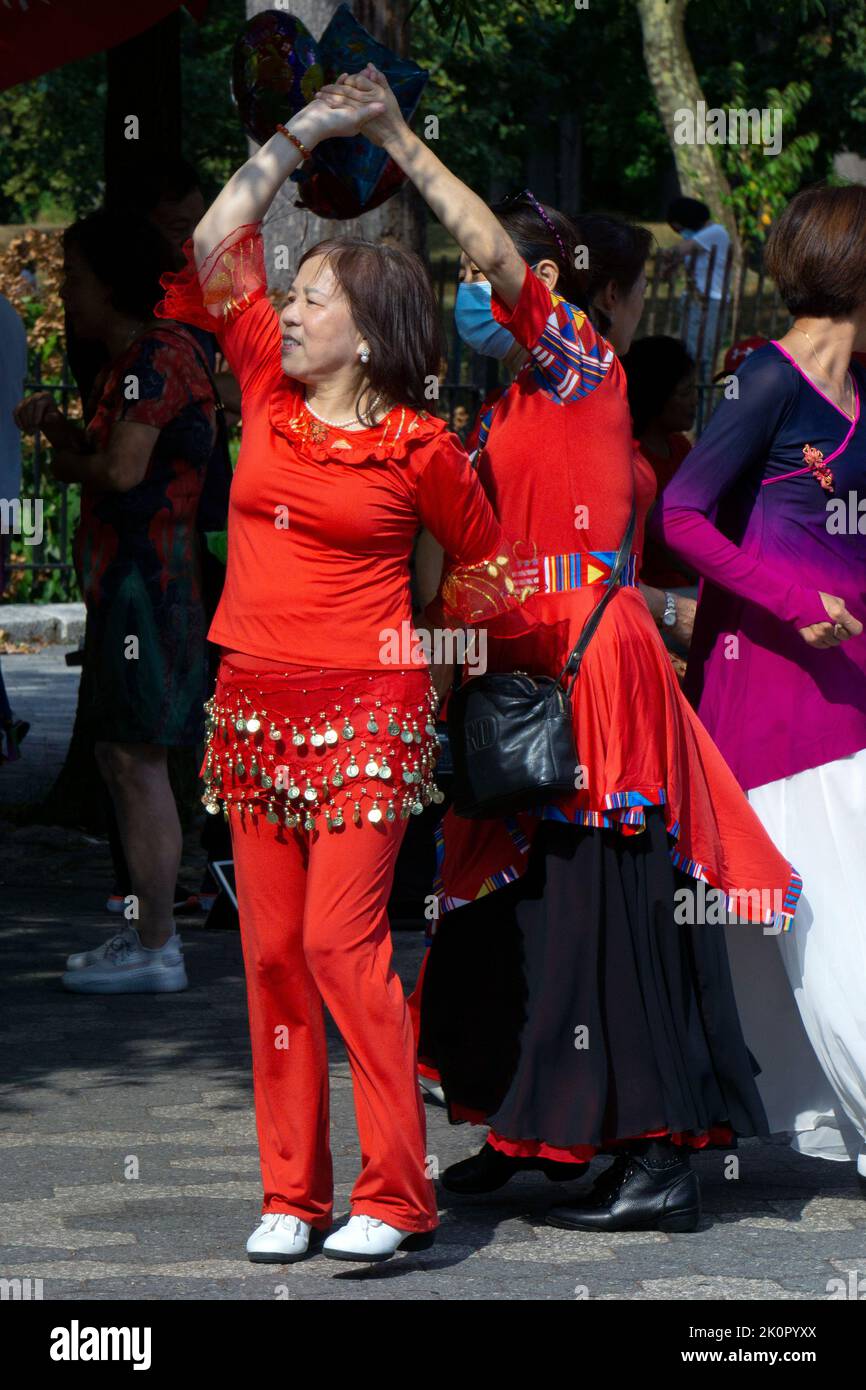 Chinese immigrant women dance at a birthday party for a member of their ...