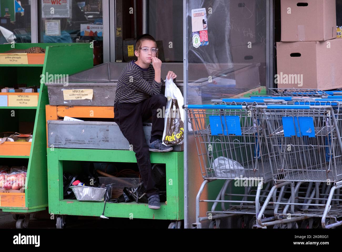 A young orthodox Jewish boy is inventive in finding a place to wait for ...