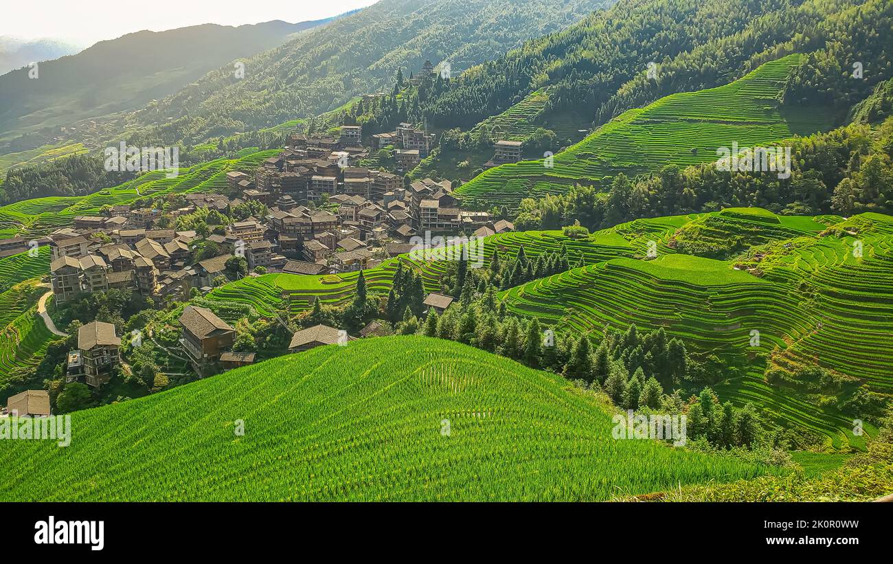 Top view of village in mountains. Terraced fields. Winding road. China ...