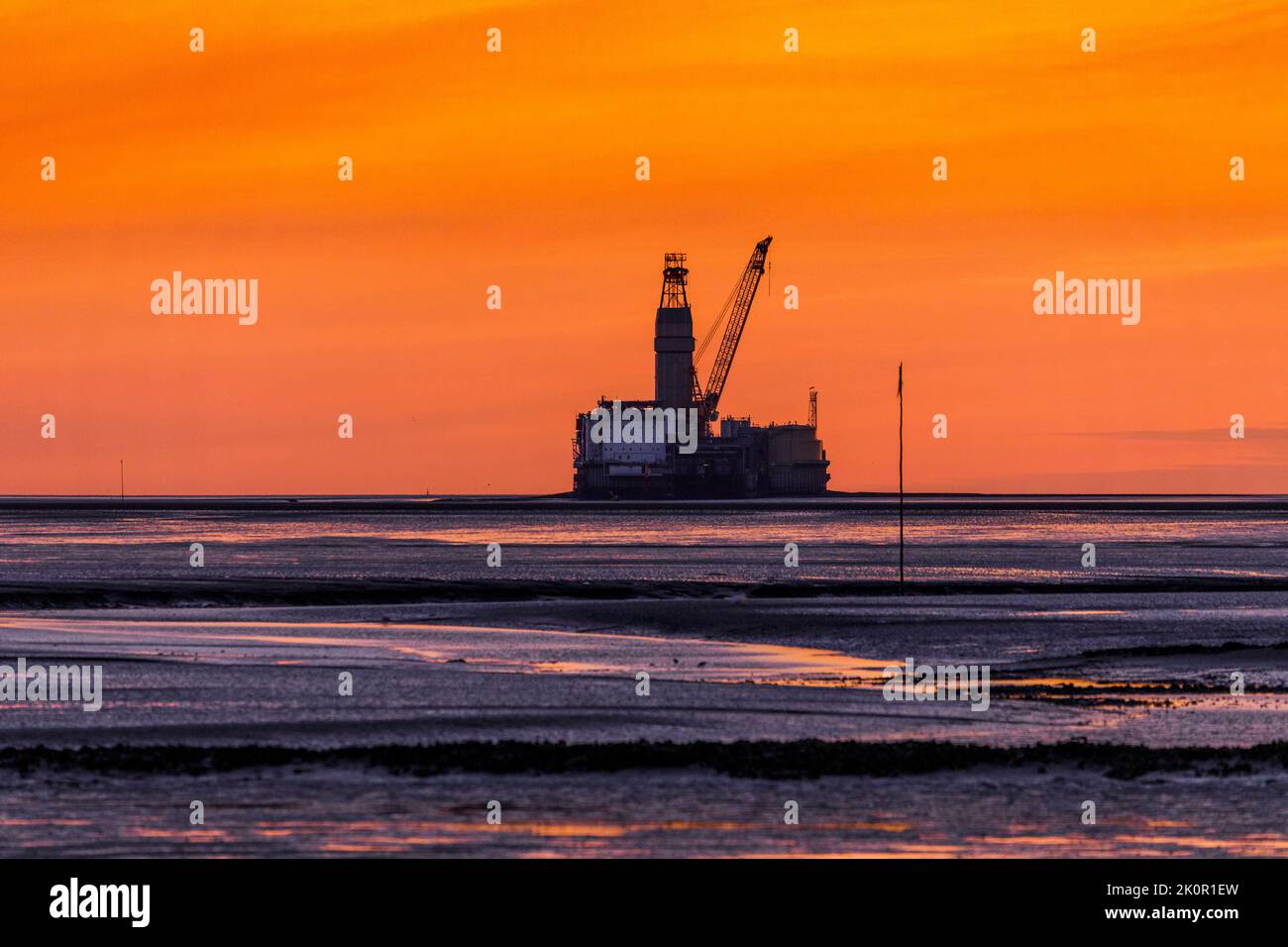 Germany's only oil rig "Mittelplate" at night Stock Photo - Alamy