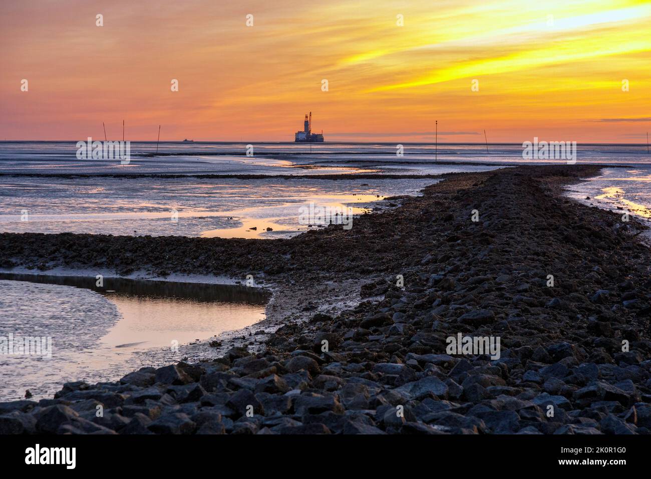 Germany's only oil rig "Mittelplate" at night Stock Photo - Alamy