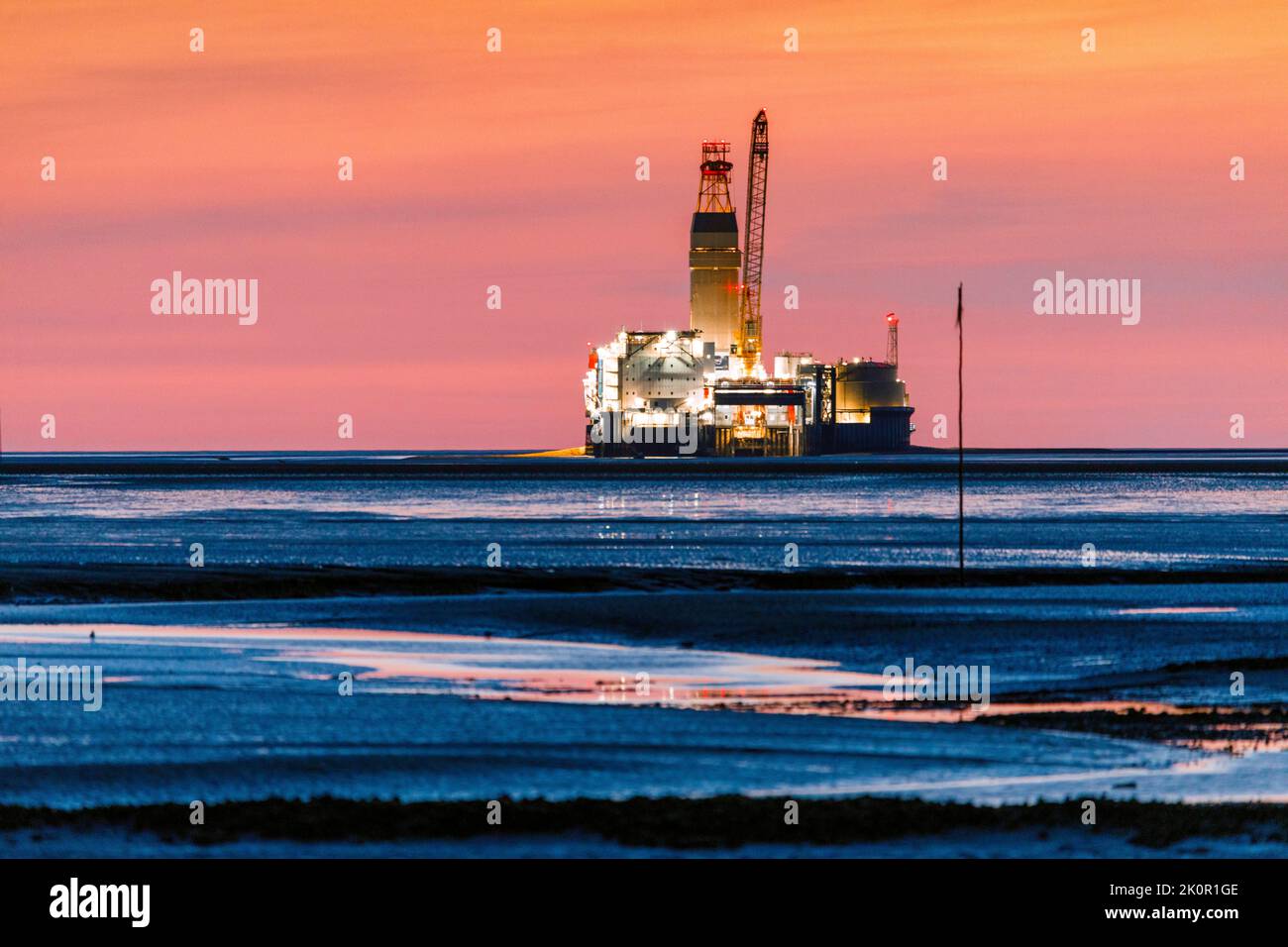 Germany's only oil rig "Mittelplate" at night Stock Photo - Alamy