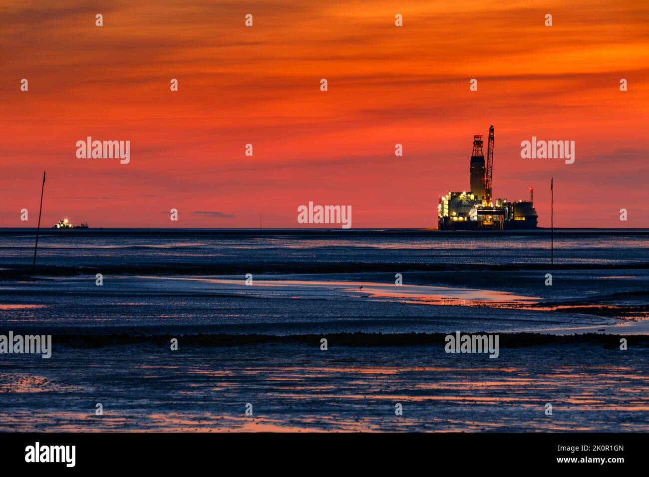 Germany's only oil rig "Mittelplate" at night Stock Photo - Alamy