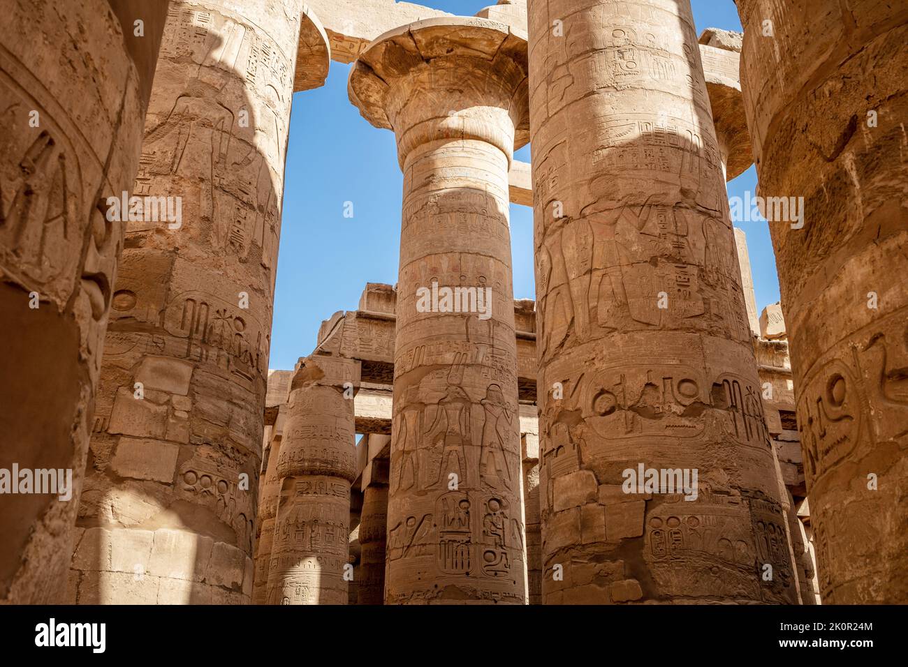 Different hieroglyphs on the walls and columns in the Karnak temple. Karnak temple is the ...
