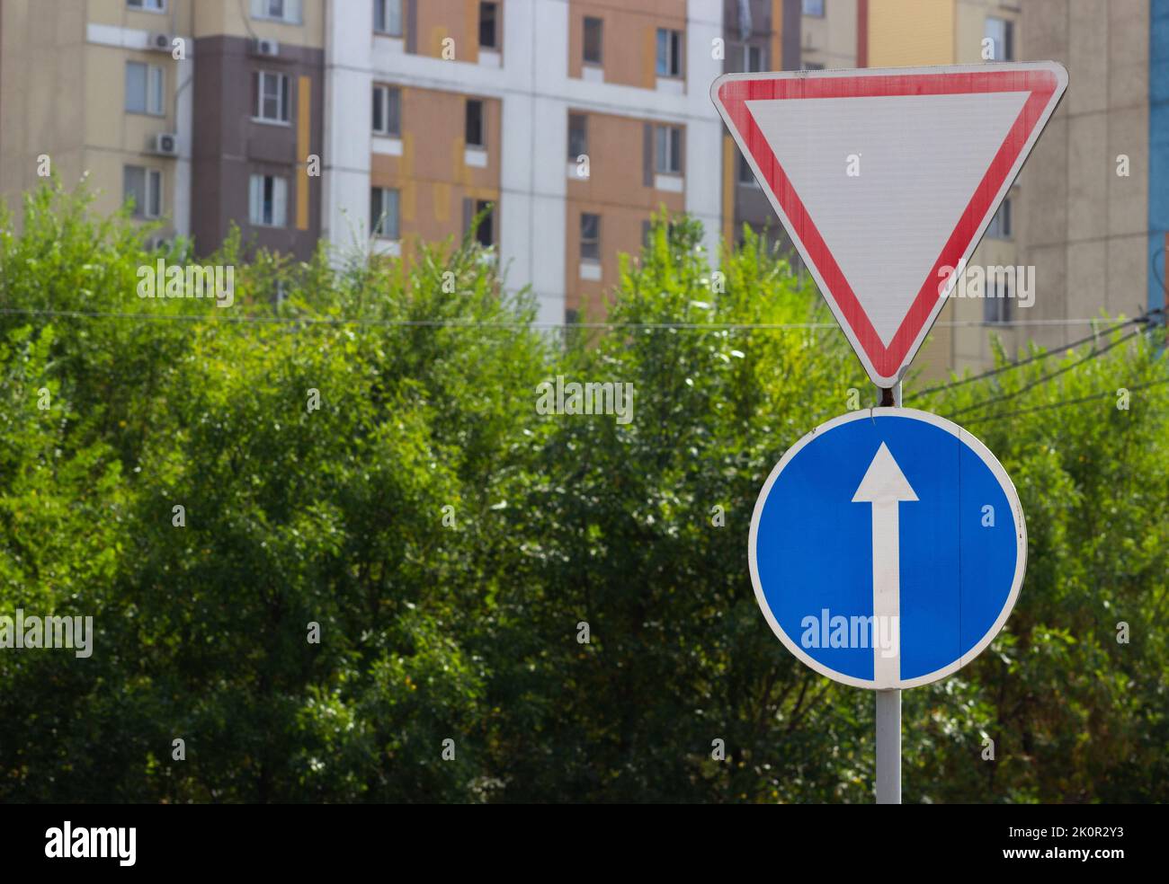 traffic direction sign white arrow on blue background Stock Photo - Alamy