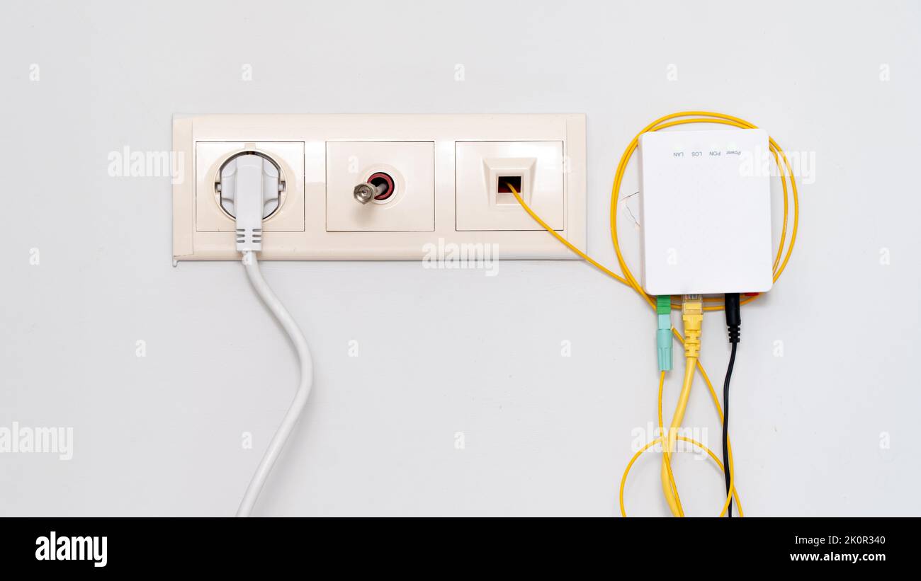 Wires, sockets, cable and internet router Stock Photo - Alamy