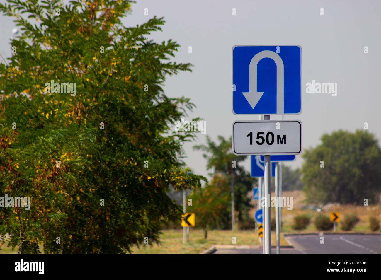 traffic direction sign white reverse arrow on blue background Stock ...