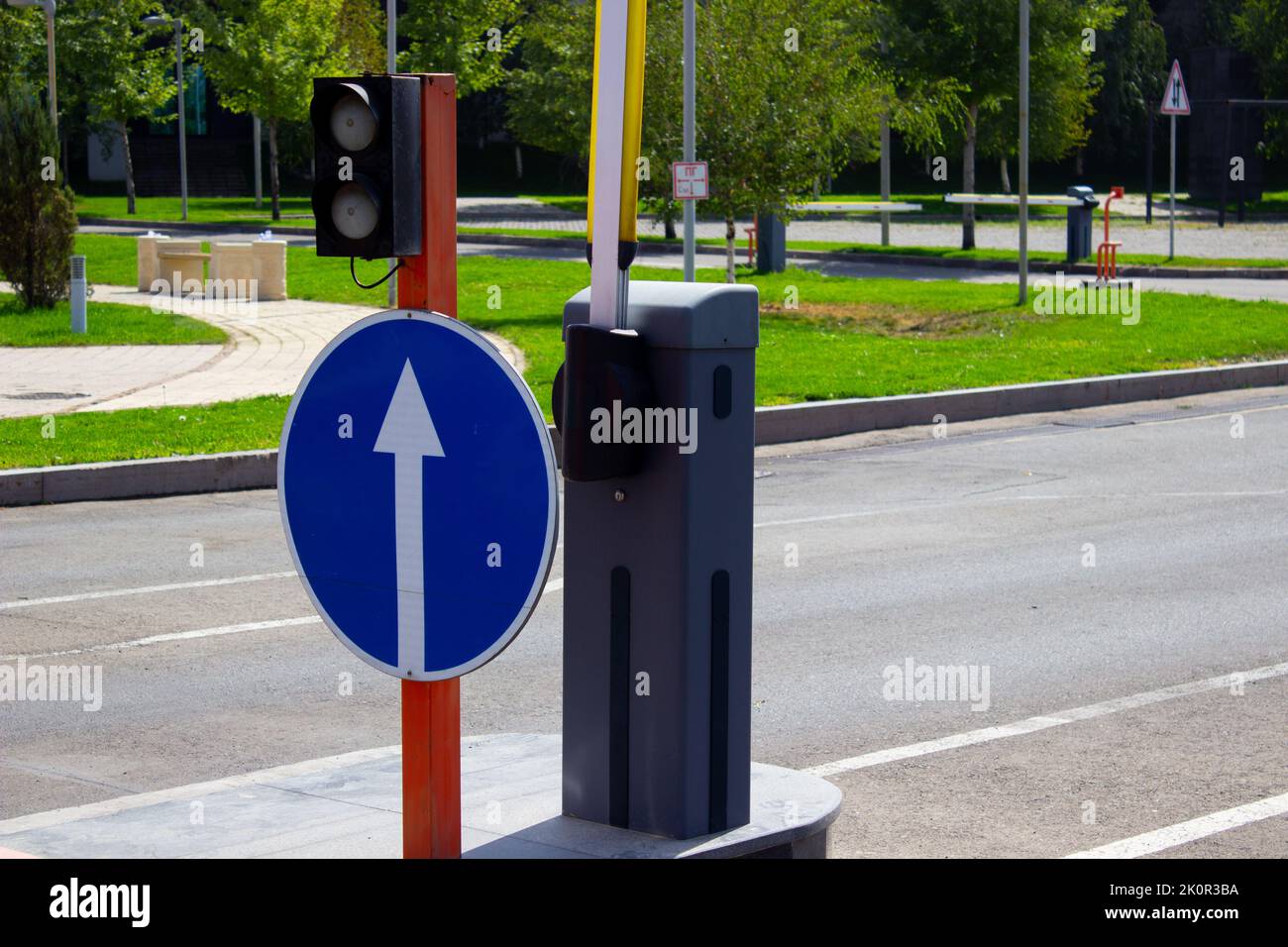 traffic direction sign at the barrier white arrow on blue background ...
