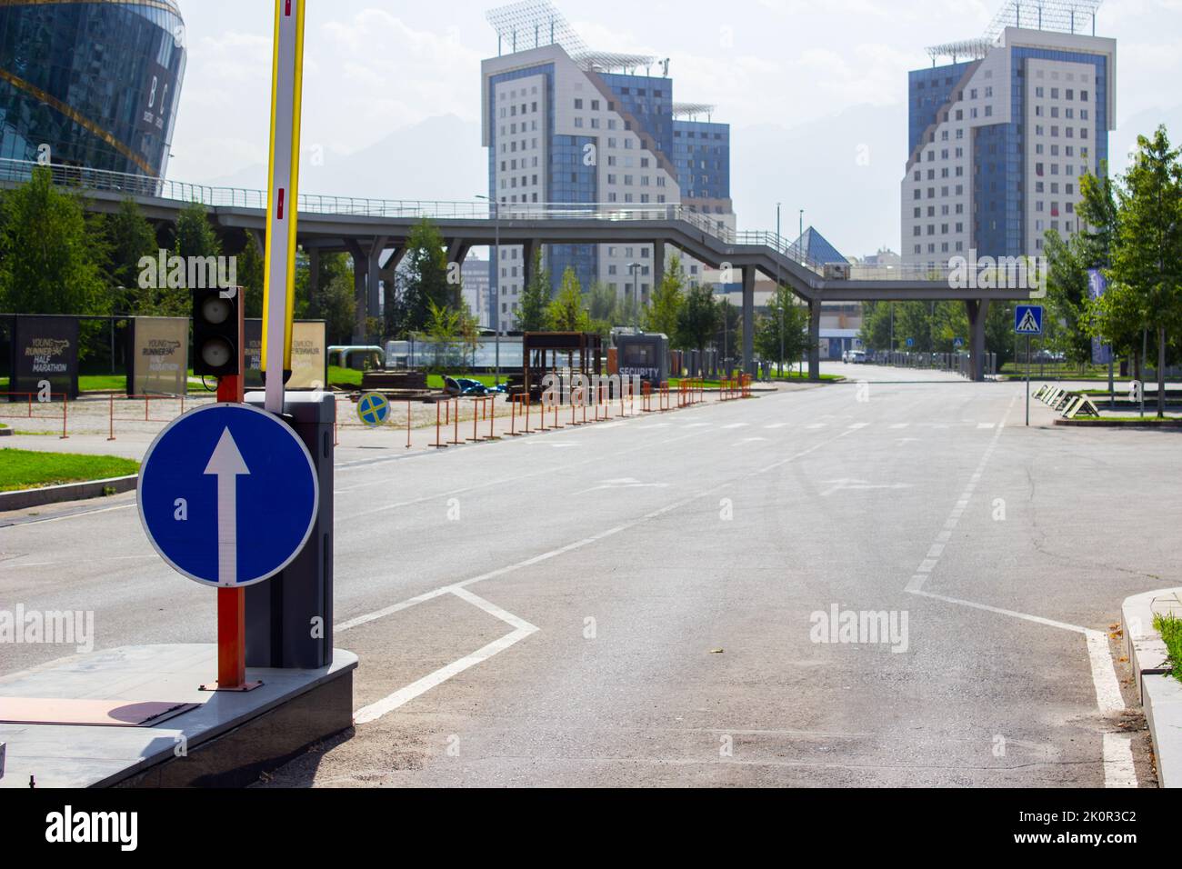 traffic direction sign at the barrier white arrow on blue background ...