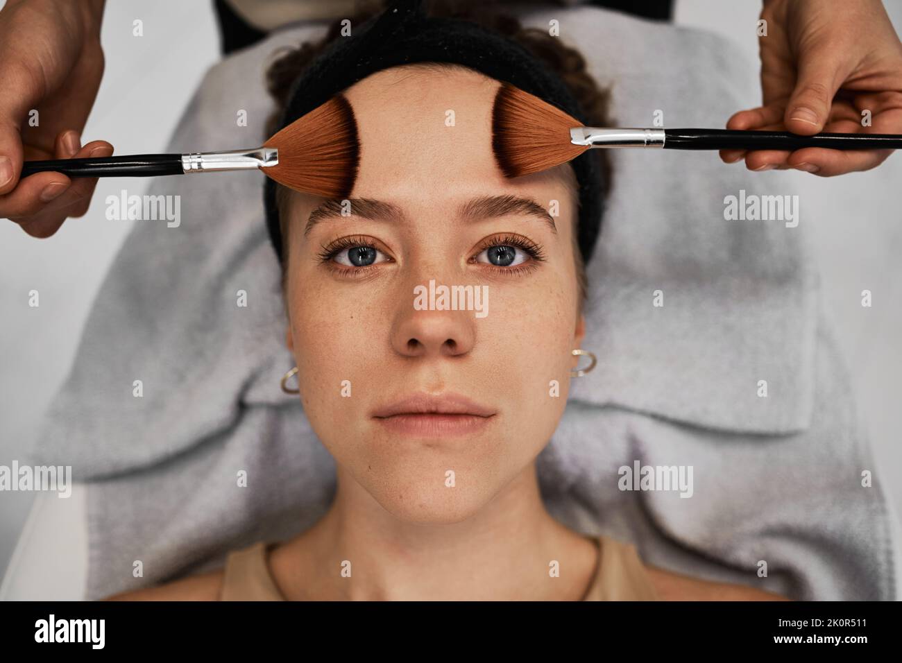 Face massage with brushes Stock Photo - Alamy