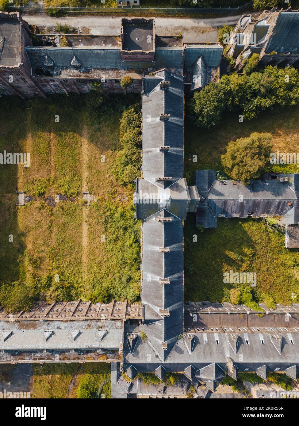 Aerial birds eye view of abandoned mansion house and boarding school. A ...