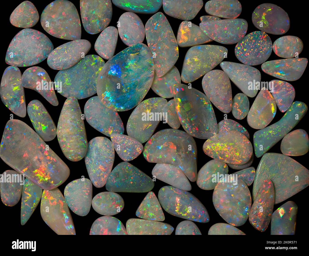 Australian Opal gemstones, shot on a black background to highlight the ...