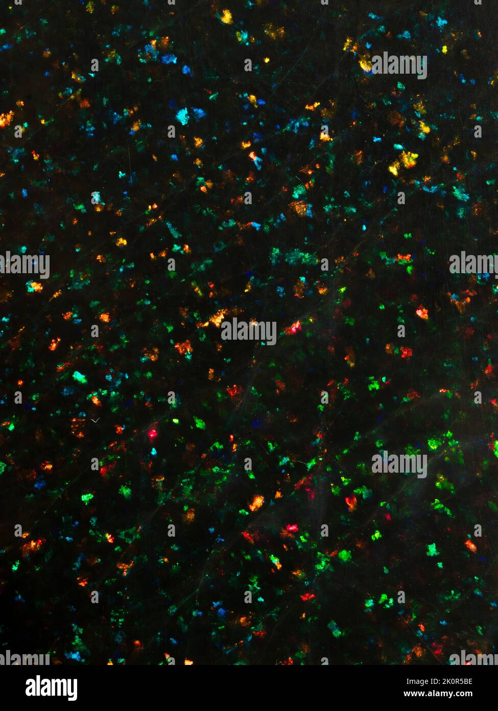 Australian Opal gemstones, shot on a black background to highlight the ...