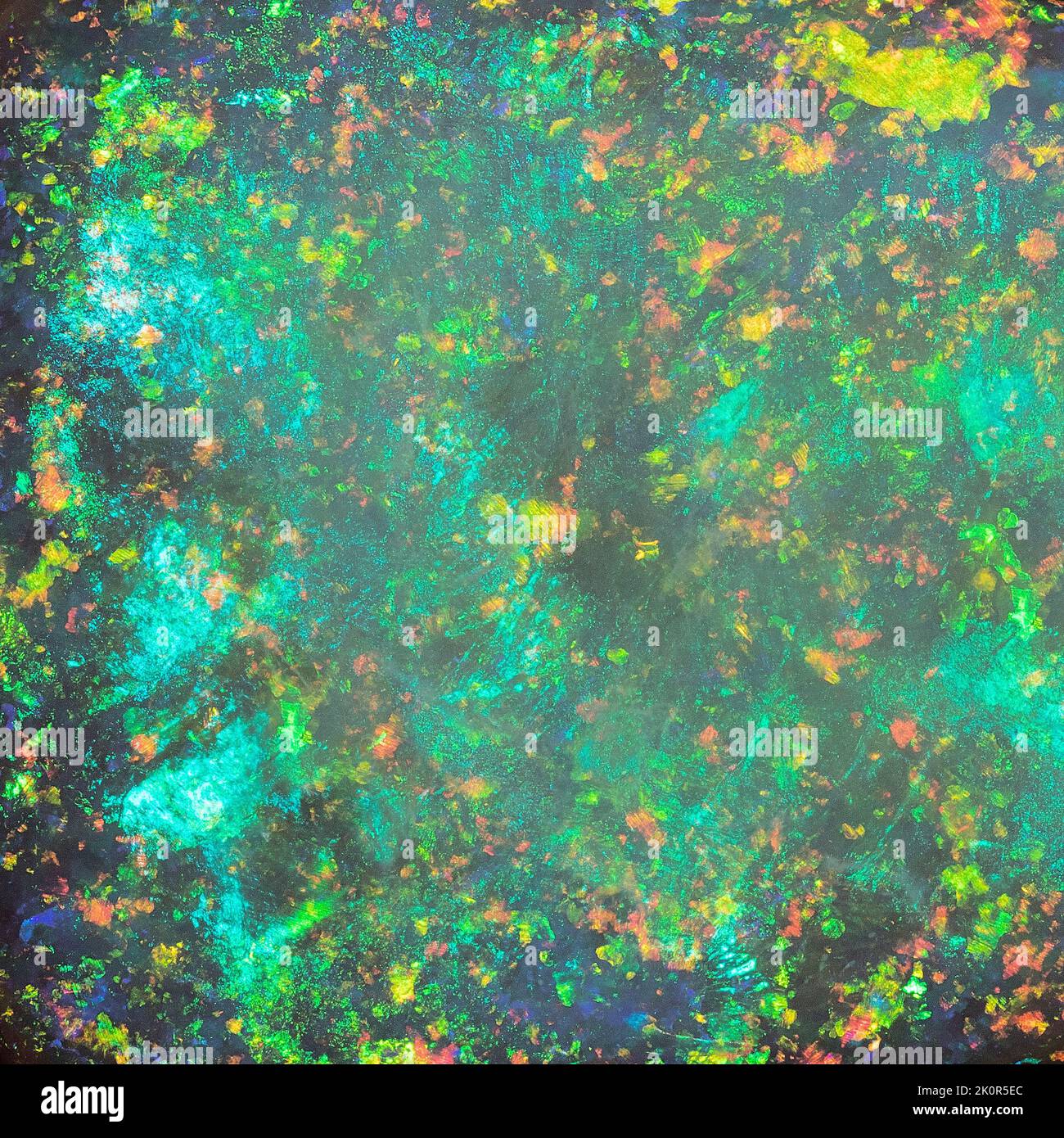 Australian Opal gemstones, shot on a black background to highlight the ...