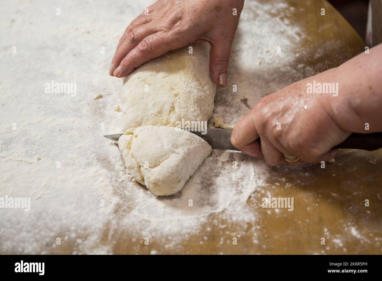 Dough bun for making noodles, prepared on the table with ingredients ...