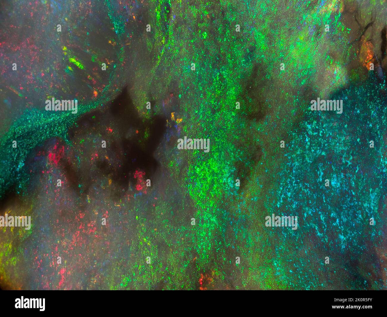 Australian Opal gemstones, shot on a black background to highlight the ...