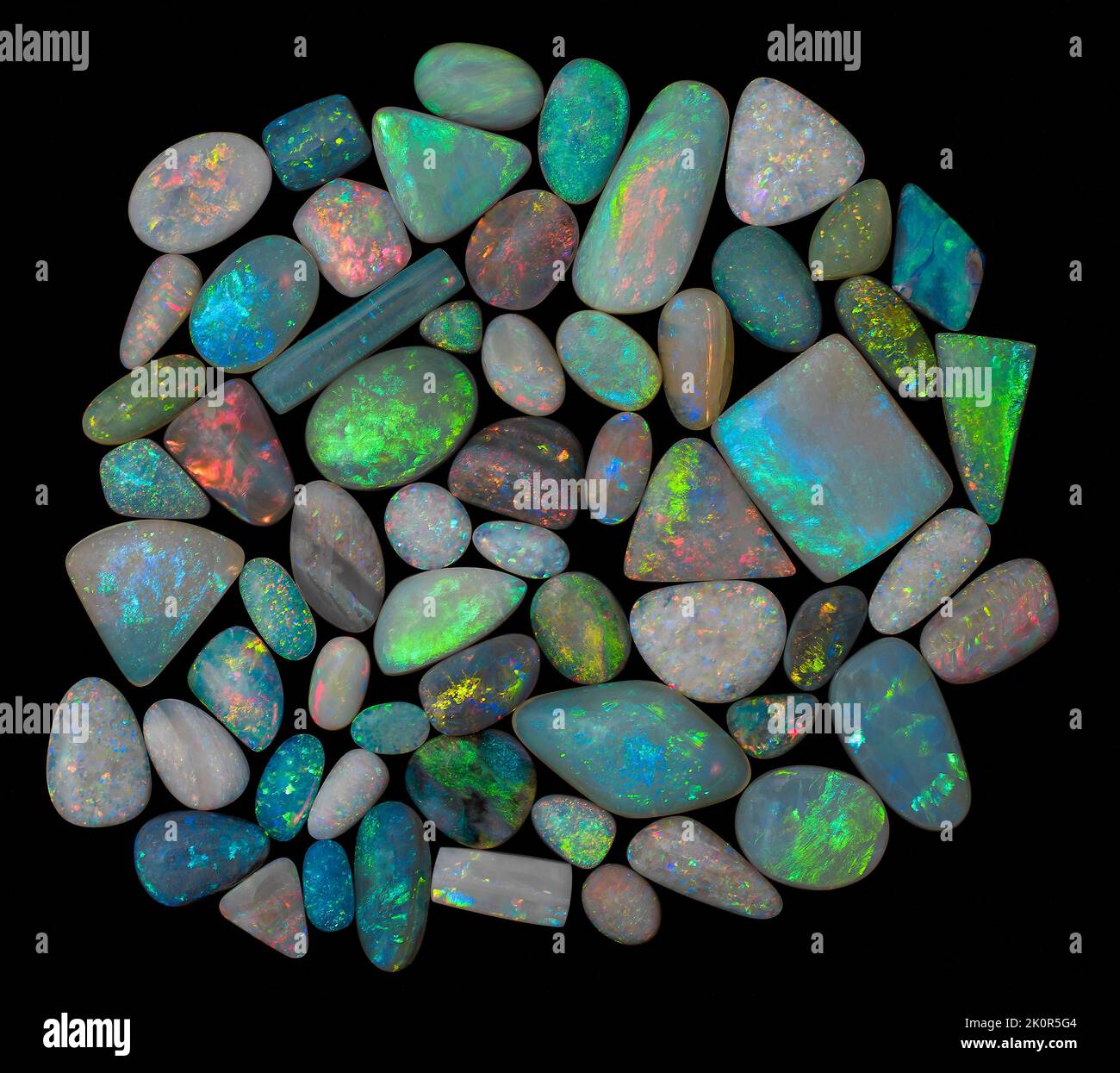 Australian Opal gemstones, shot on a black background to highlight the ...