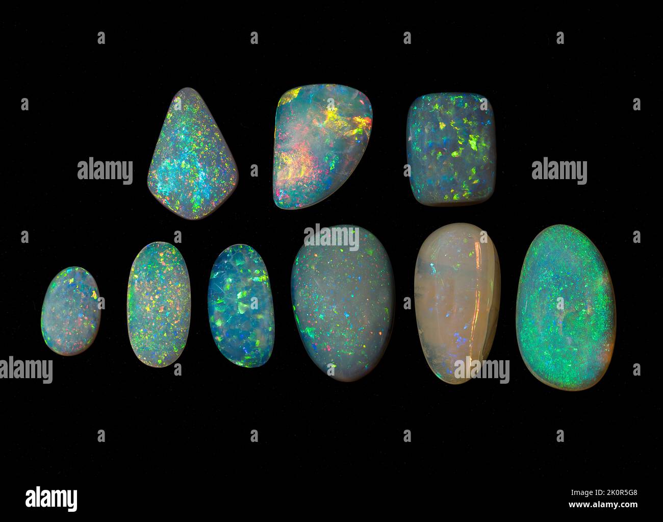 Australian Opal gemstones, shot on a black background to highlight the ...