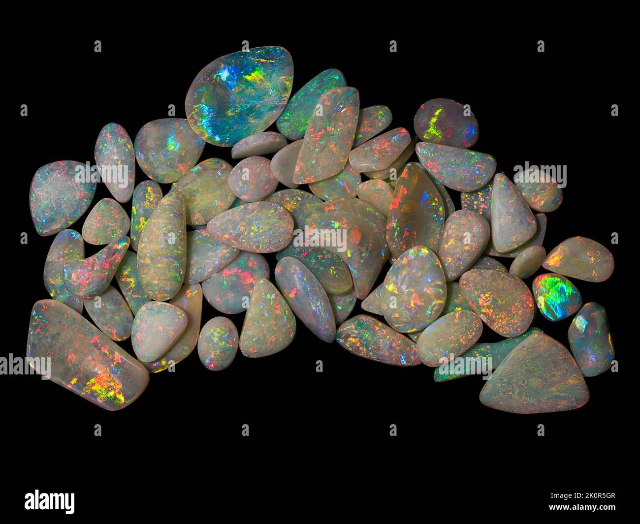 Australian Opal gemstones, shot on a black background to highlight the ...