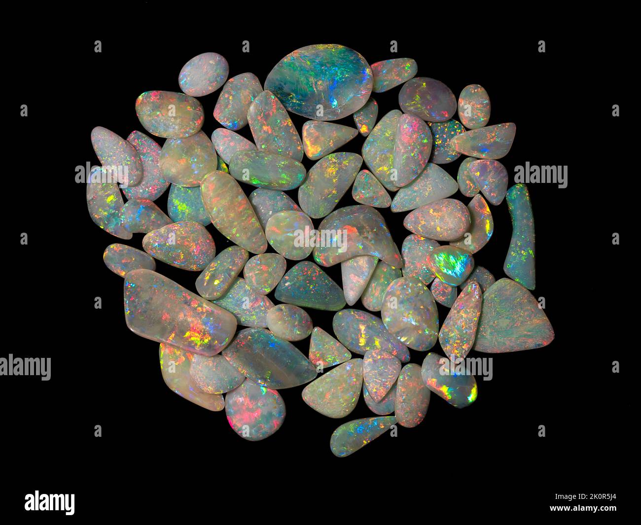 Australian Opal gemstones, shot on a black background to highlight the ...
