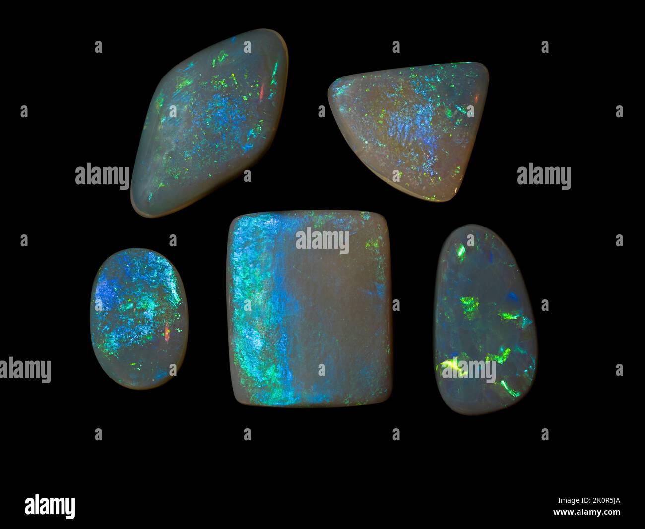 Australian Opal gemstones, shot on a black background to highlight the ...