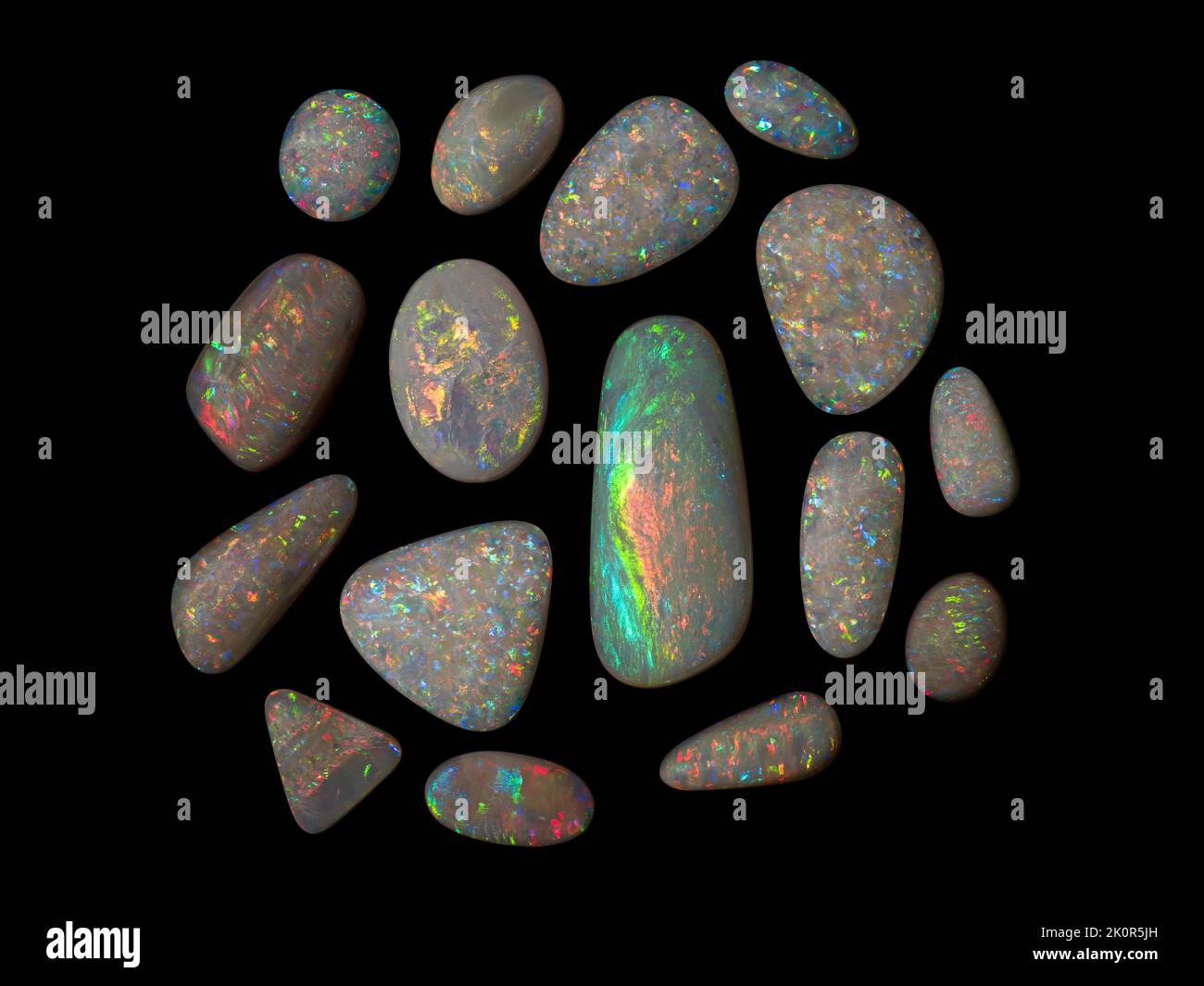 Australian Opal gemstones, shot on a black background to highlight the ...