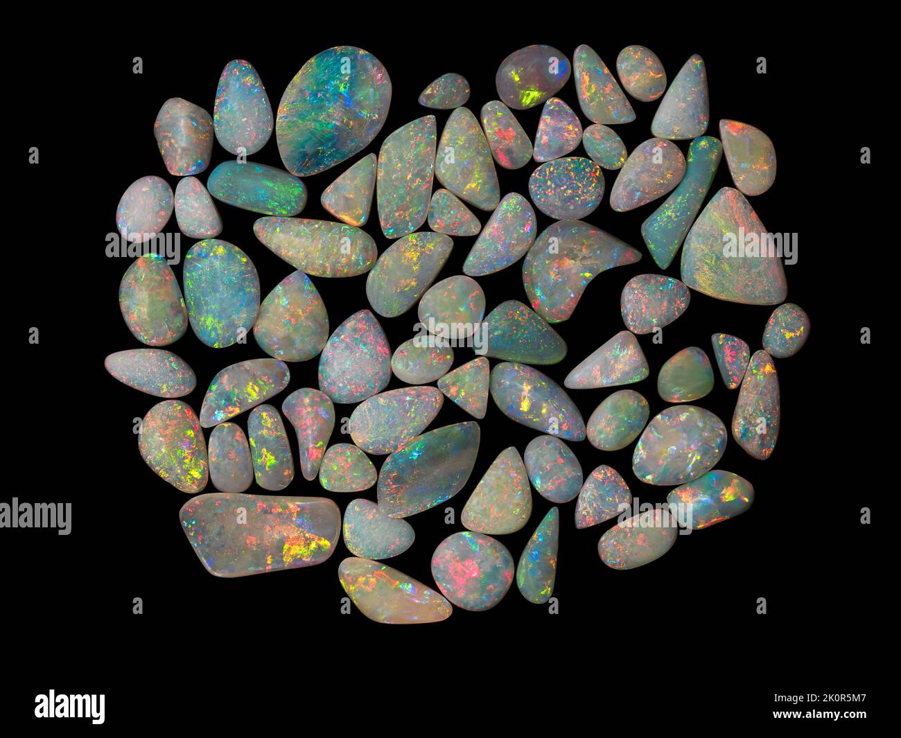 Australian Opal gemstones, shot on a black background to highlight the ...