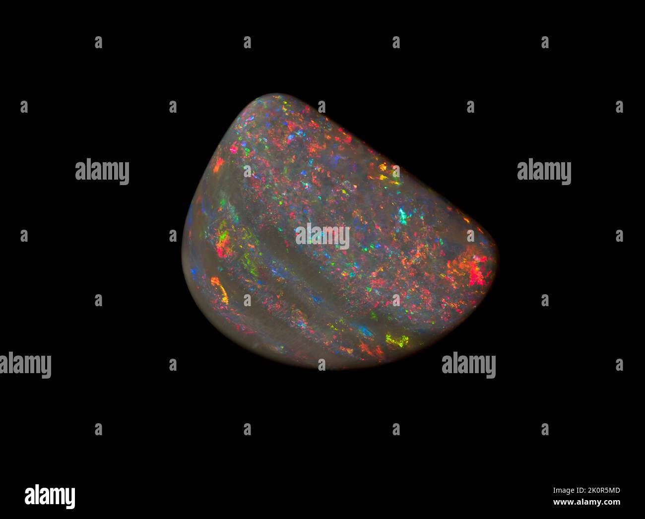 Australian Opal gemstones, shot on a black background to highlight the ...