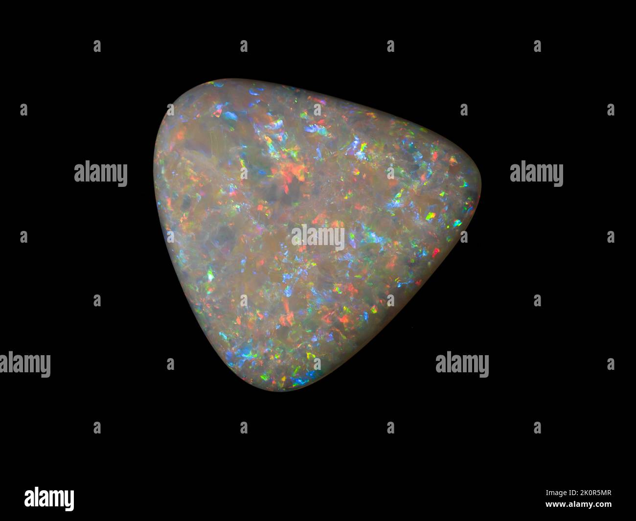 Australian Opal gemstones, shot on a black background to highlight the ...