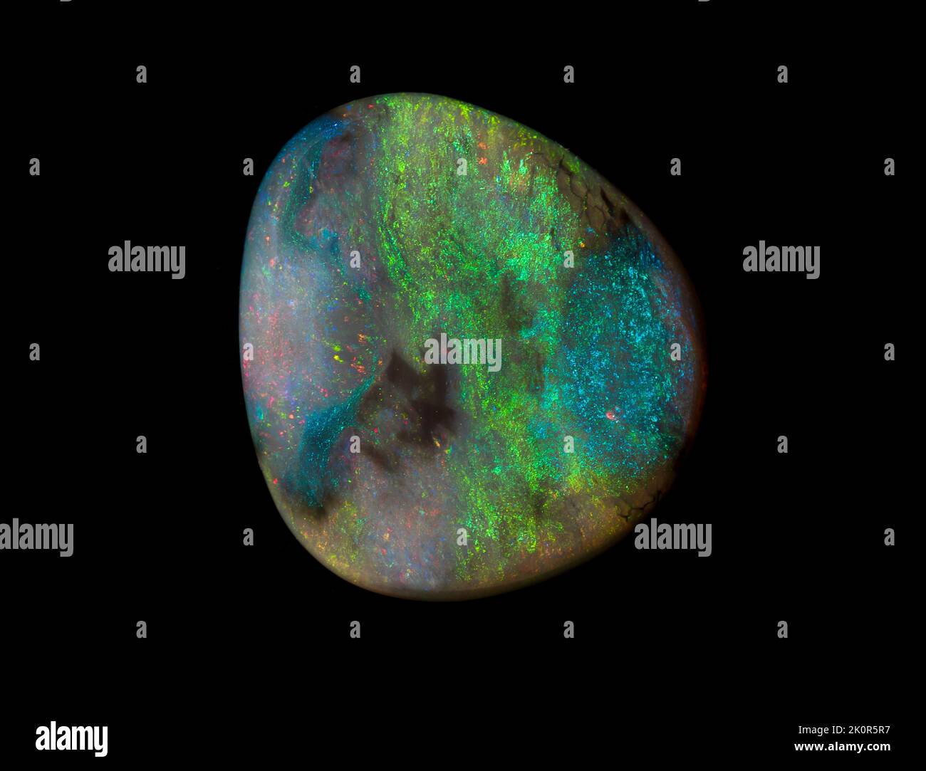 Australian Opal gemstones, shot on a black background to highlight the ...
