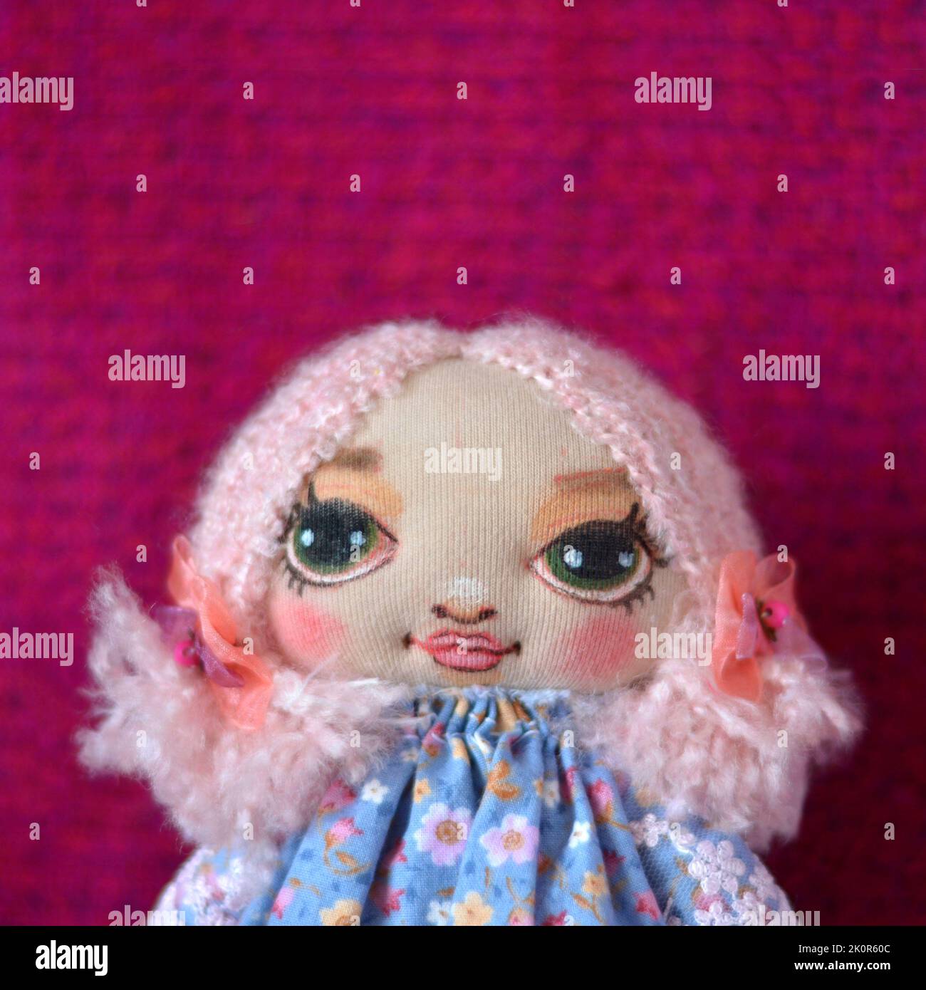 Handmade girl doll in a dress with pink hair and two ponytails Stock ...