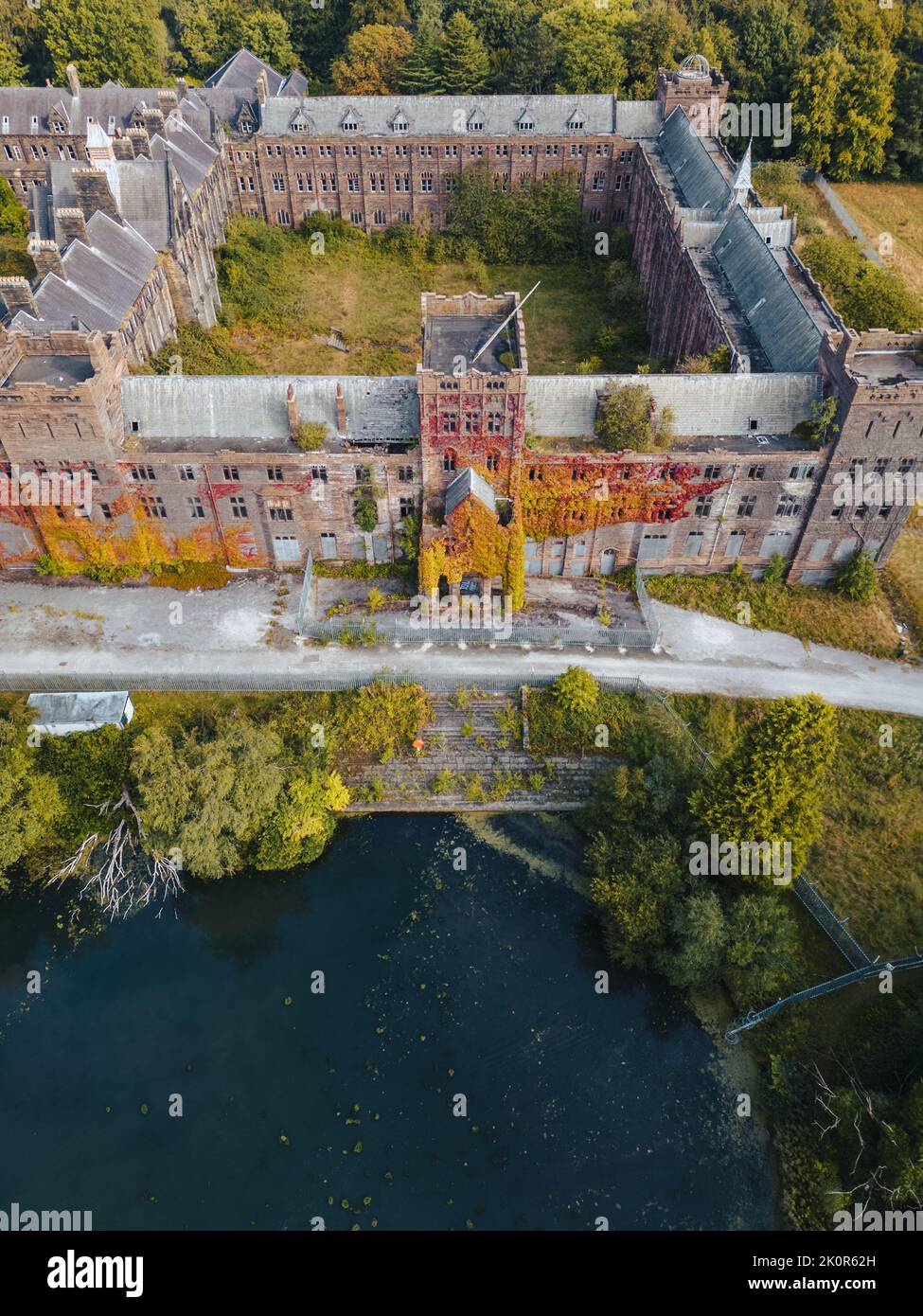 Vertical shot, aerial view of abandoned house and boarding school. A ...