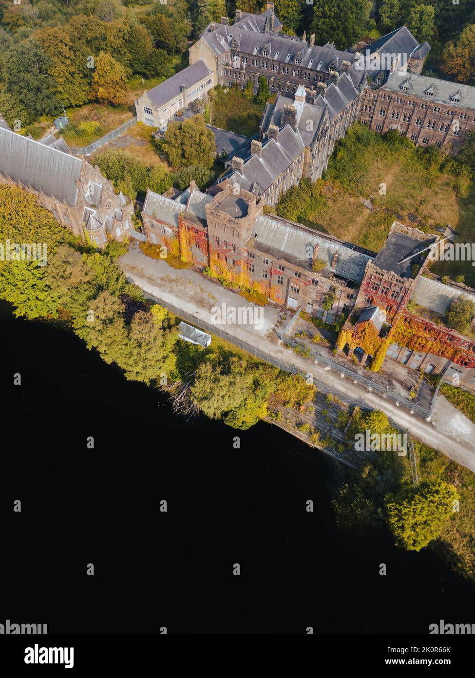 Vertical shot, aerial view of abandoned house and boarding school. A ...