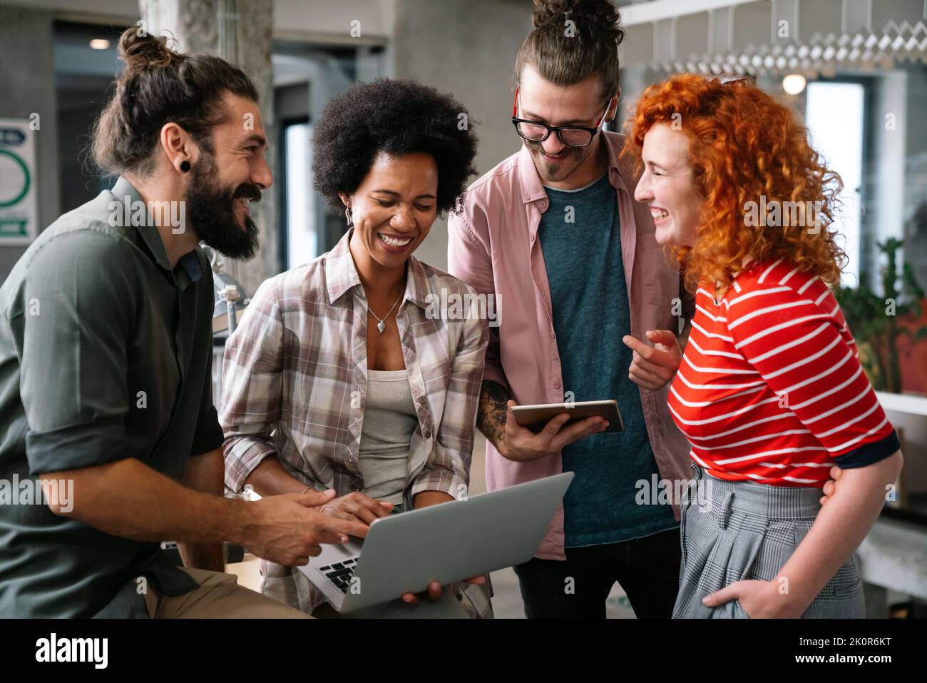 Diverse group of professionals meeting in office. IT programmers use ...