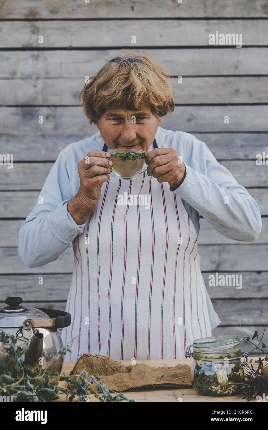 Grandmother makes tea medicinal herbs hi-res stock photography and ...