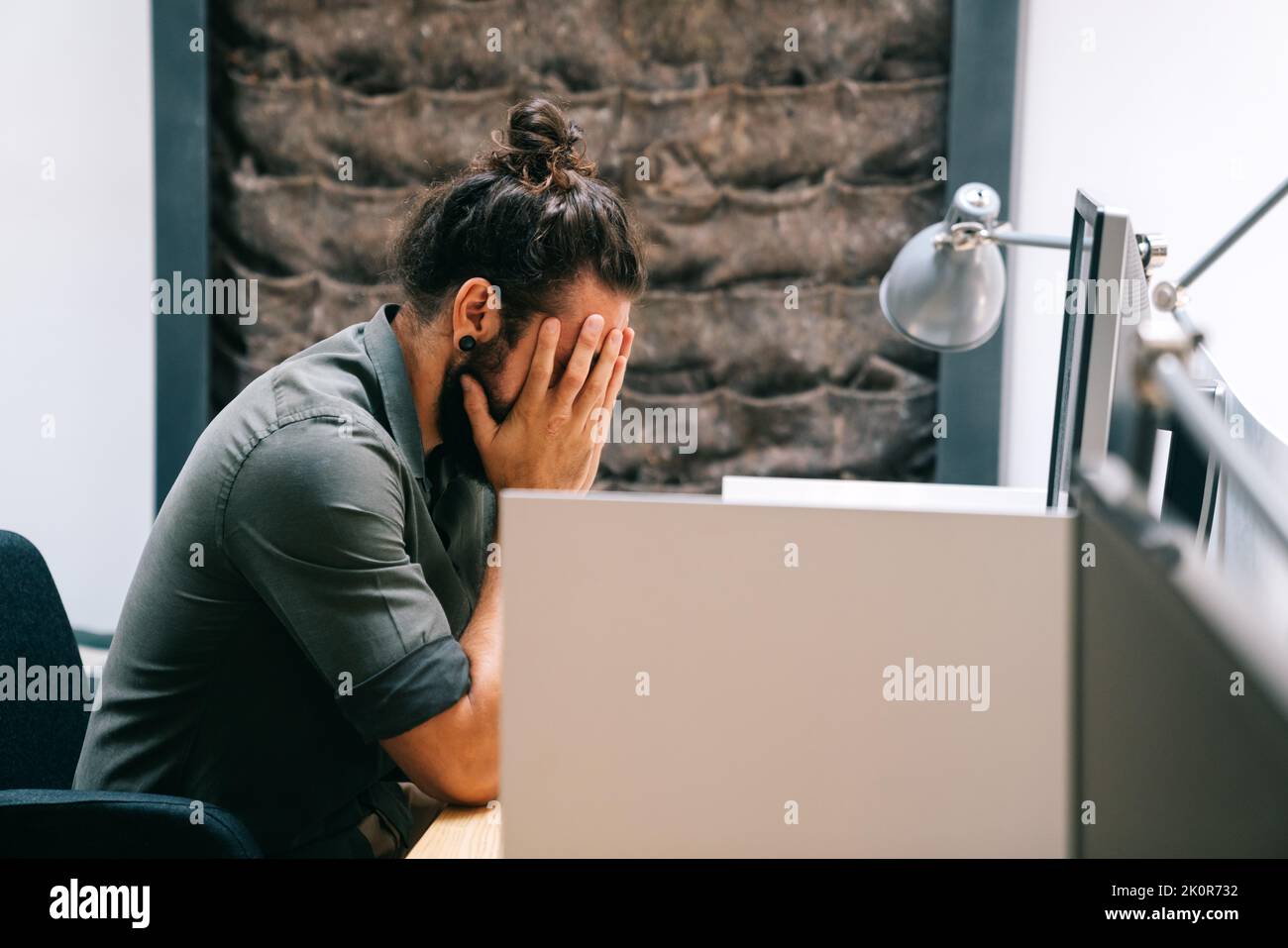 Tired exhausted man, office worker, manager or freelancer, working in ...