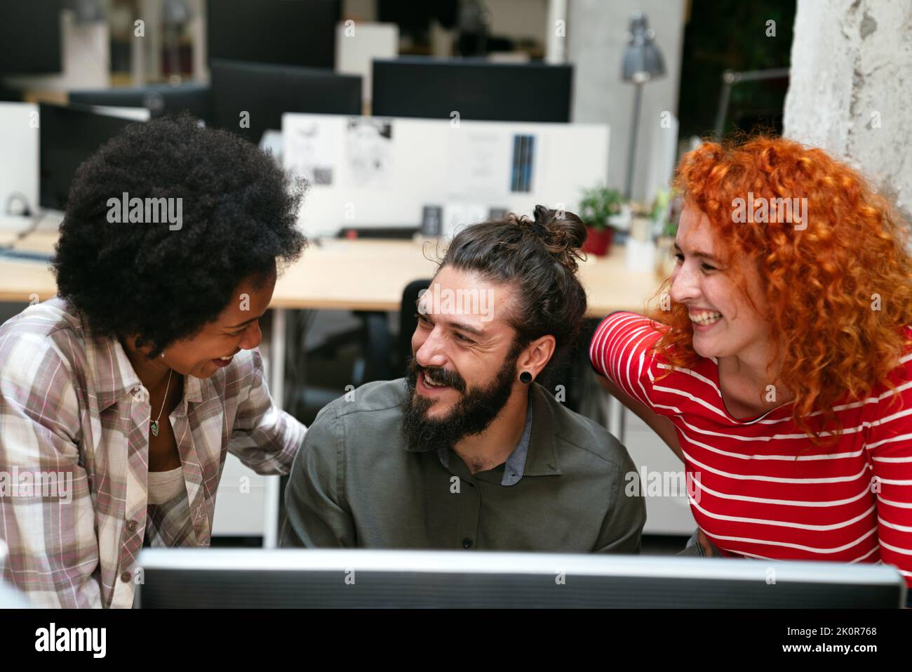 Team of young creative marketing experts brainstorming during work ...