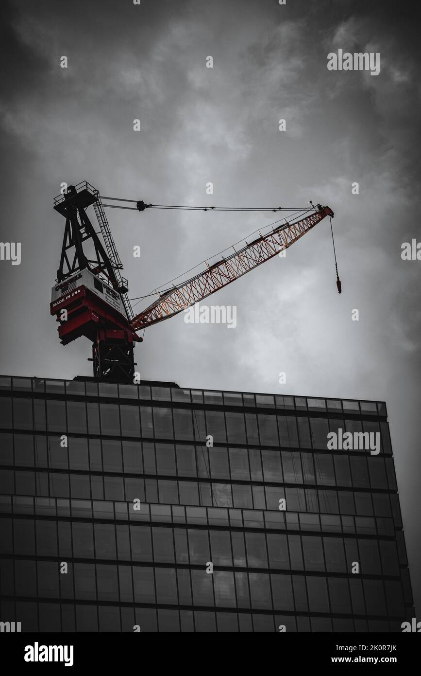 A construction crane sits on top of a Boston skyscraper Stock Photo - Alamy