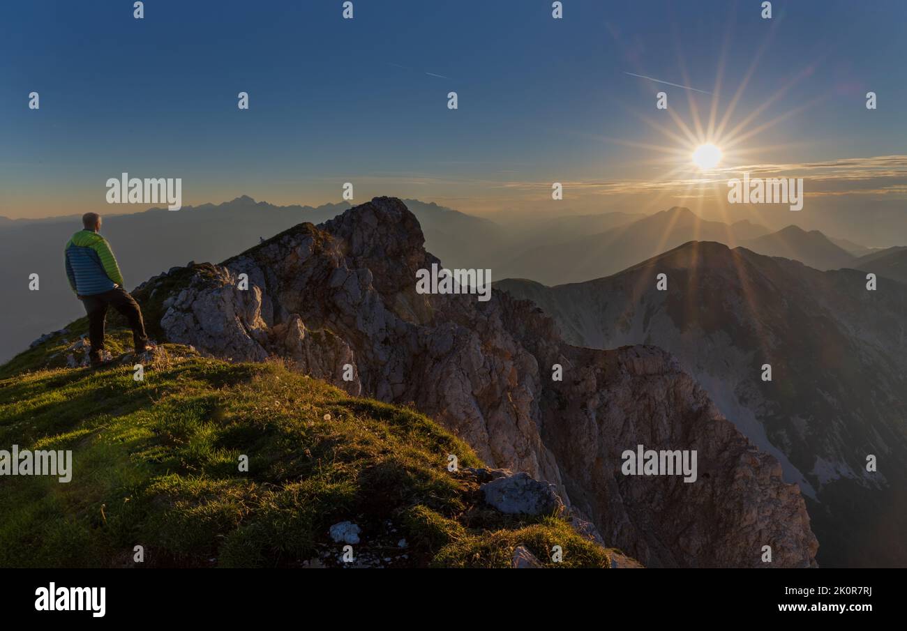 An aerial view of a hiker on the beautiful Karavanke mountain chain at ...