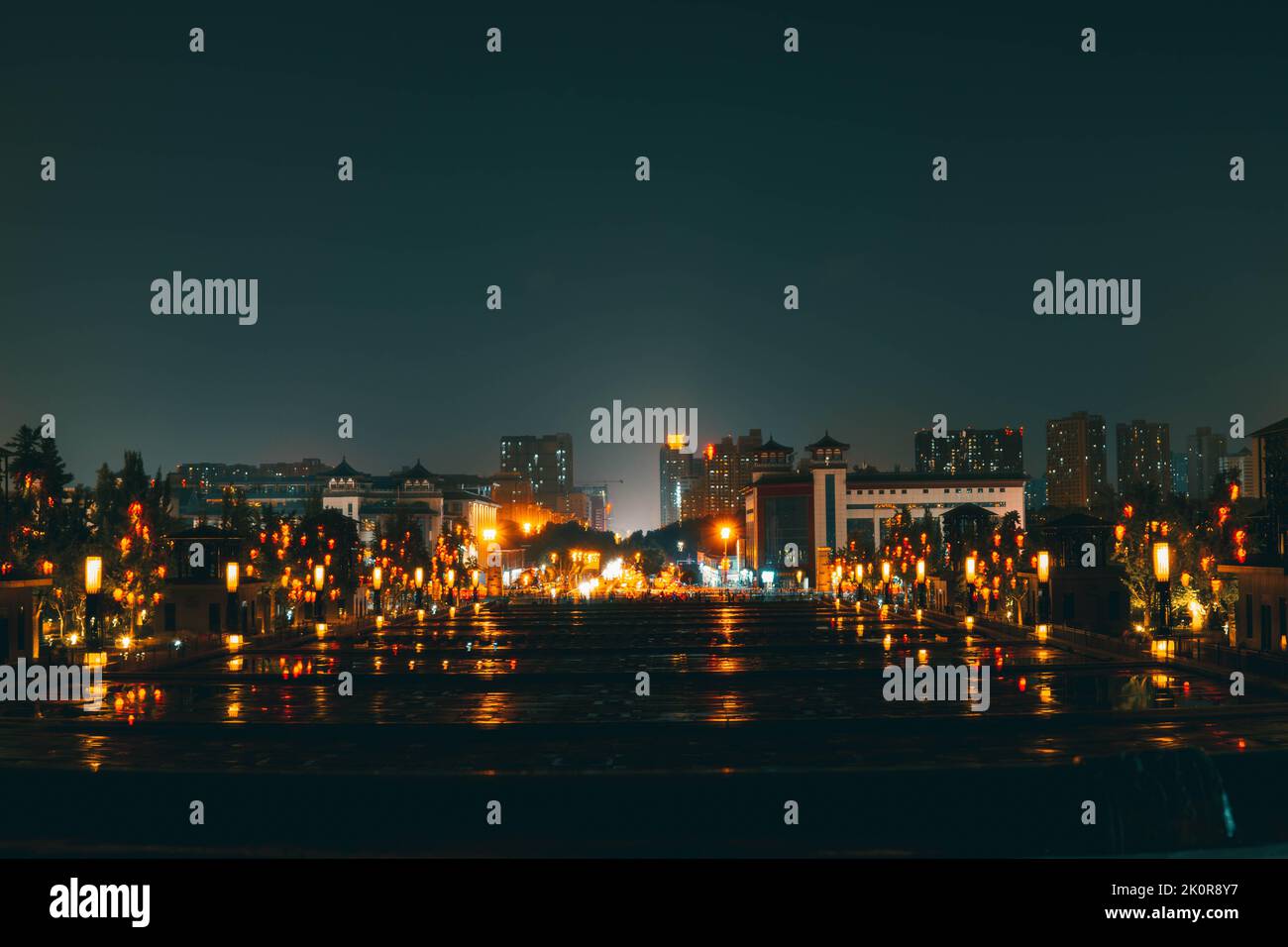The city building with bright lights during nighttime Stock Photo - Alamy
