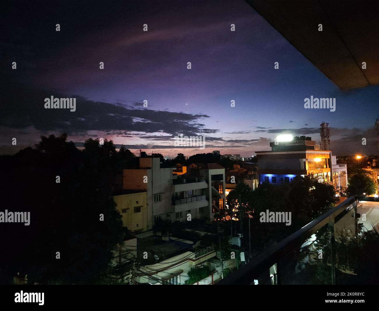 The city building with bright lights during nighttime Stock Photo - Alamy