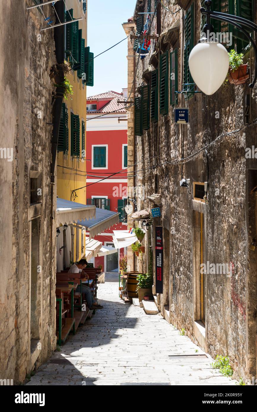 Narrow street in the touristic historic city center of Split, Croatia ...