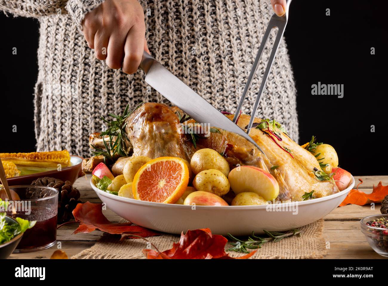 Close up of caucasian woman carving thanksgiving roast turkey with ...