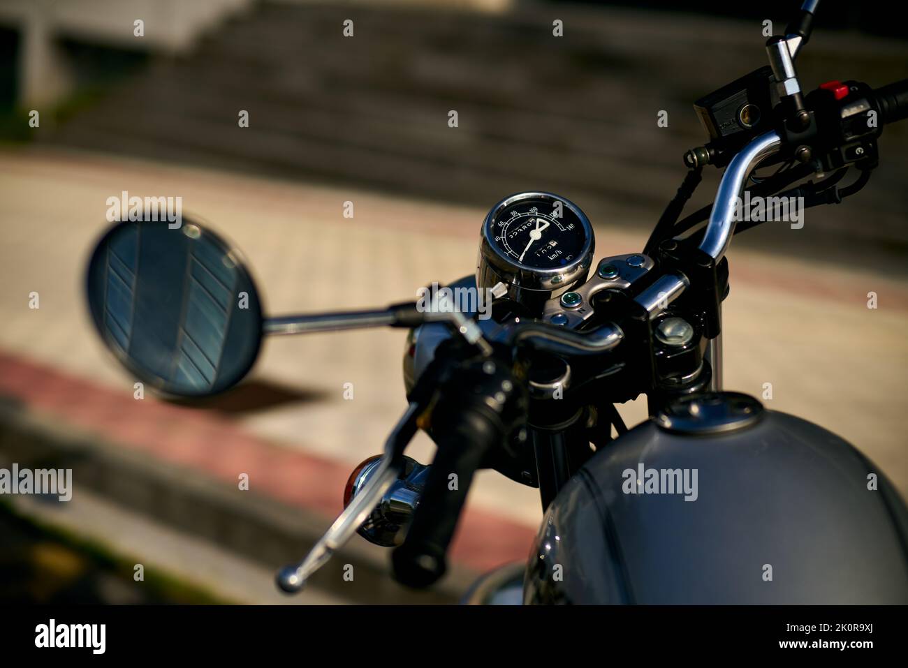 Handlebar, tank and rearview mirror of unrecognizable classic ...