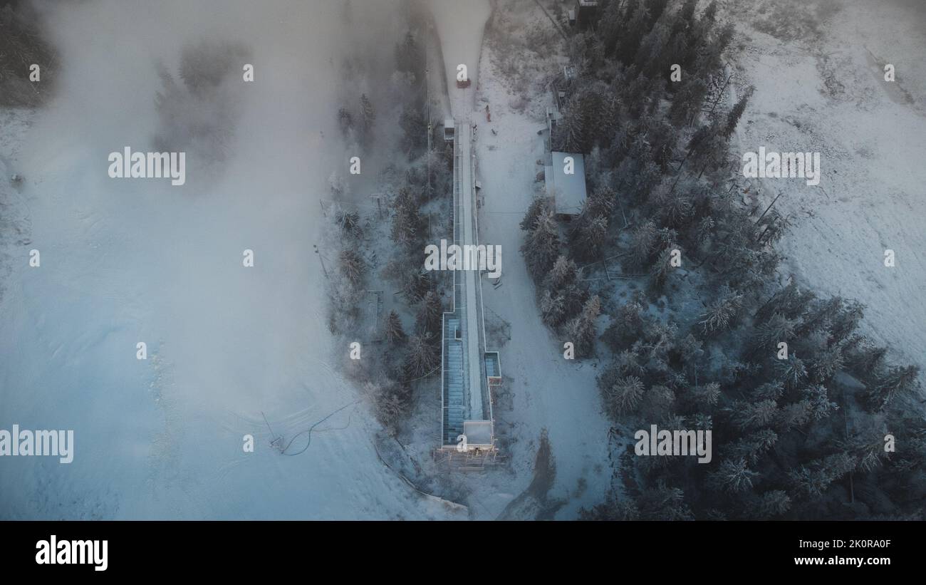 Sunrise breaking through the thick white mist at the top of Vuokatti ...