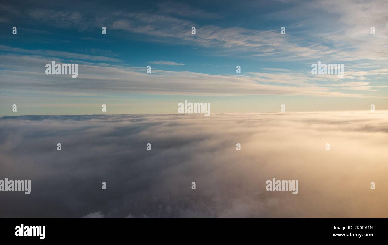 Sunrise breaking through the thick white fog at the top of Vuokatti ...
